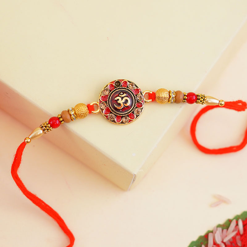 Send Stone Studded Om Rakhi Online