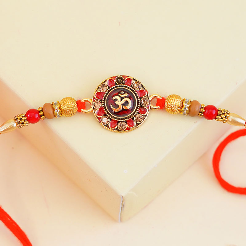 Send Stone Studded Om Rakhi Online