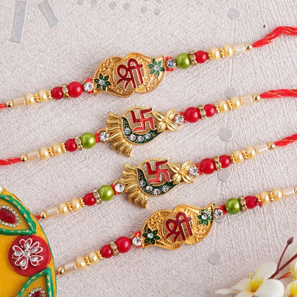 Send Two Shree and Two Swastika Golden Rakhi Set Online