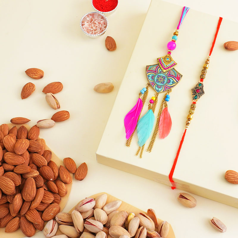 Send Alluring Couple Rakhi with Dry Fruits Combo Hamper Online