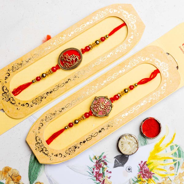 Send Veera & Ganesha Set of 2 Rakhis With Kaju Katli Online